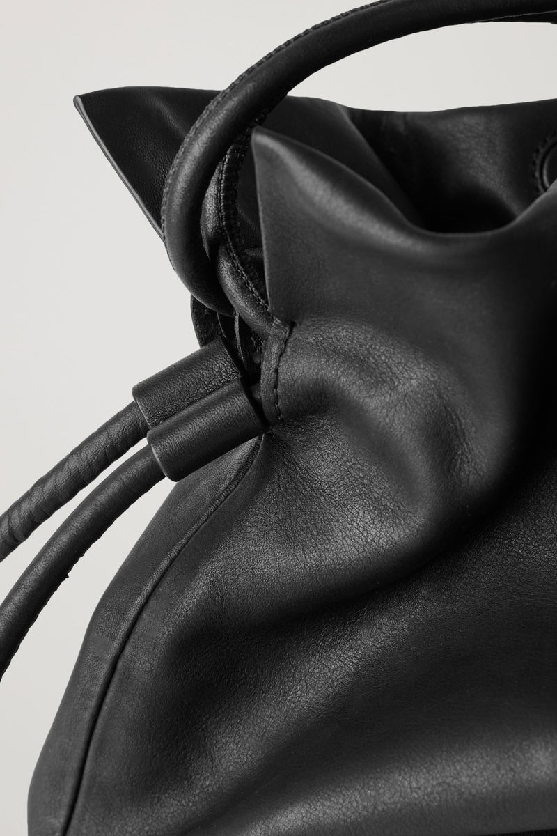 COS Drawstring Leather Bag in black | endource