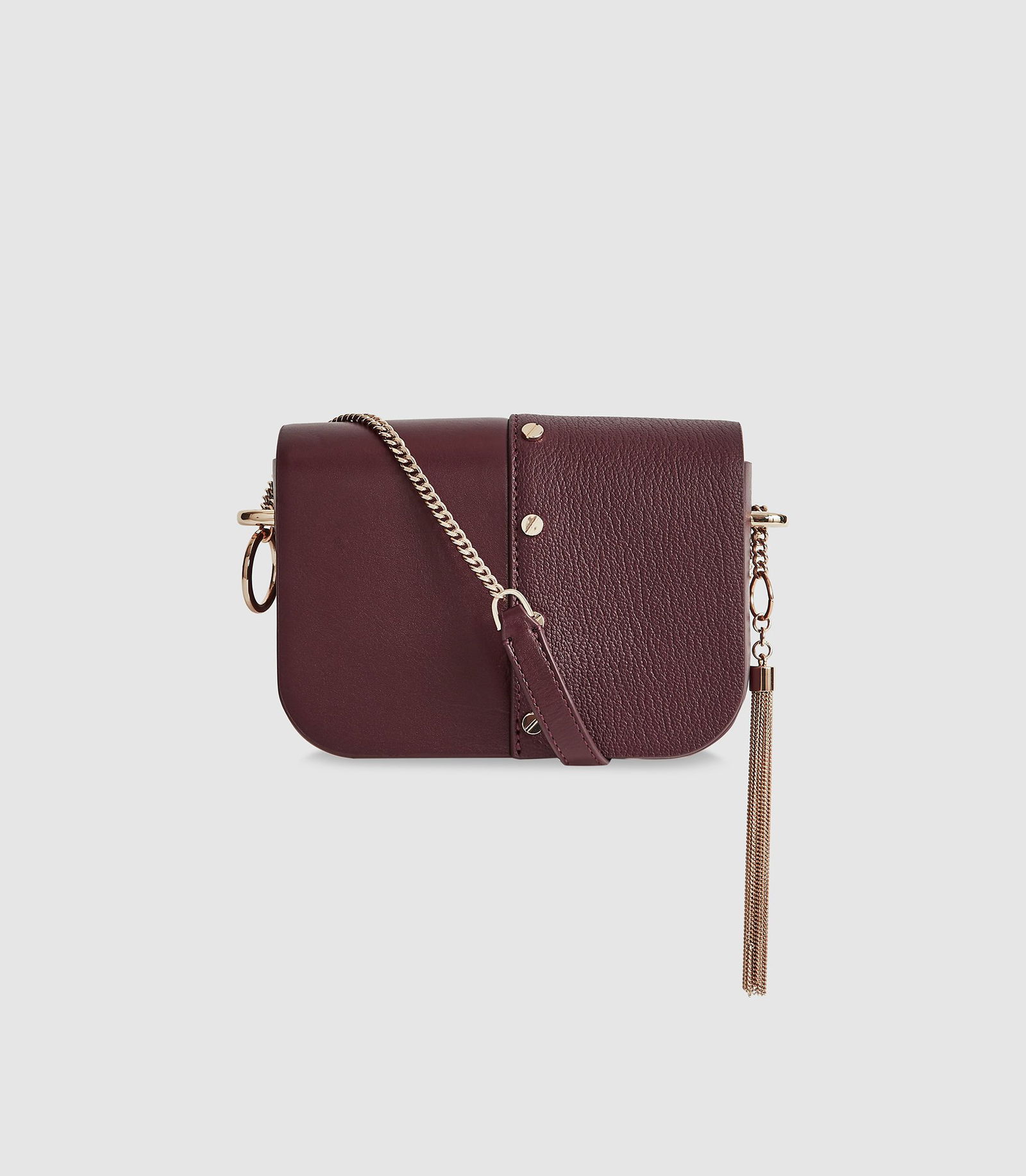 REISS Mini Jessie Leather Tassel Cross Body Bag in Berry | endource