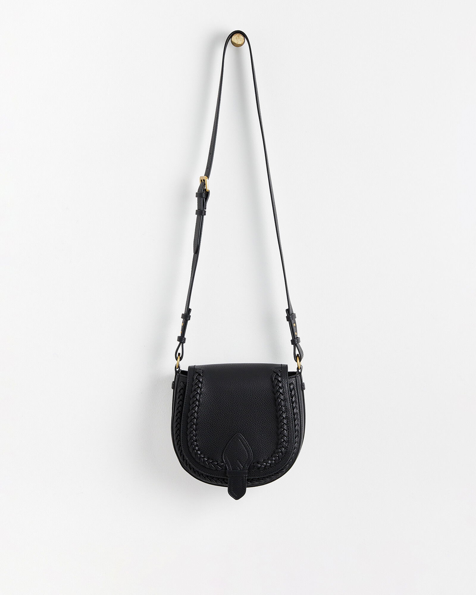 OLIVER BONAS Audra Plait Saddle Crossbody Bag in Black | endource