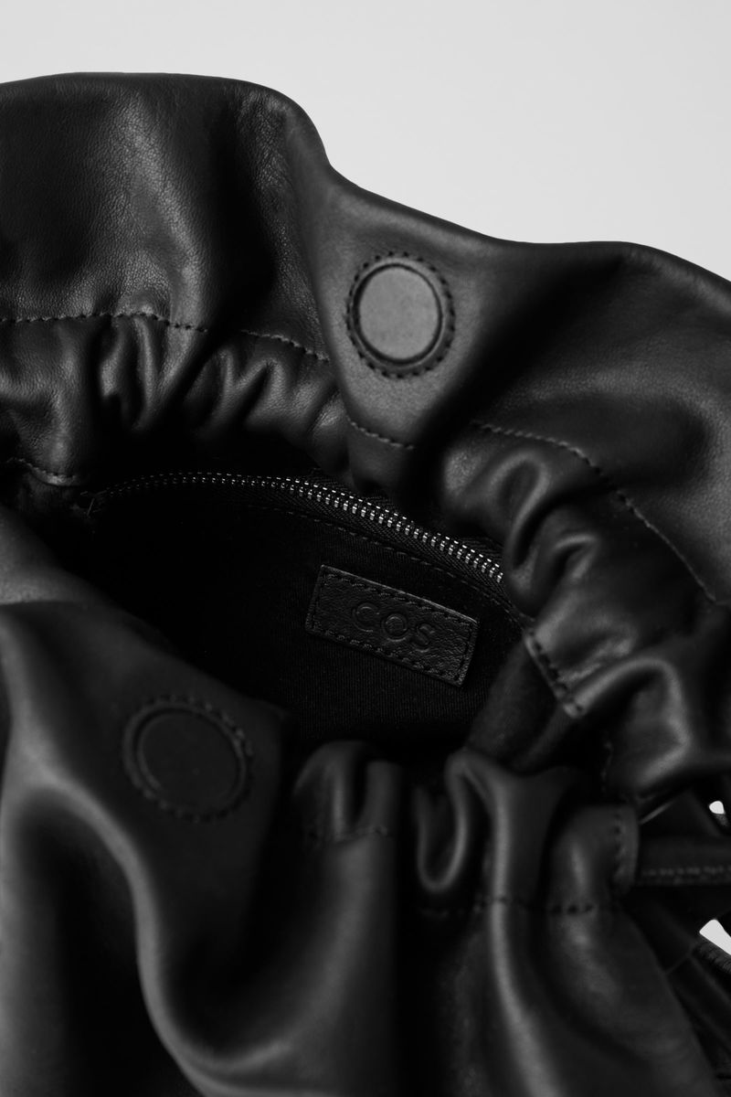 COS Drawstring Leather Bag in black | endource