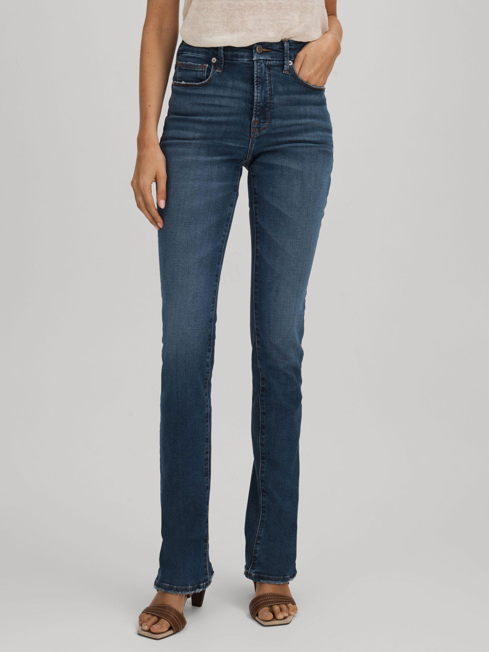 GOOD AMERICAN Distressed Bootcut Jeans in Indigo | endource