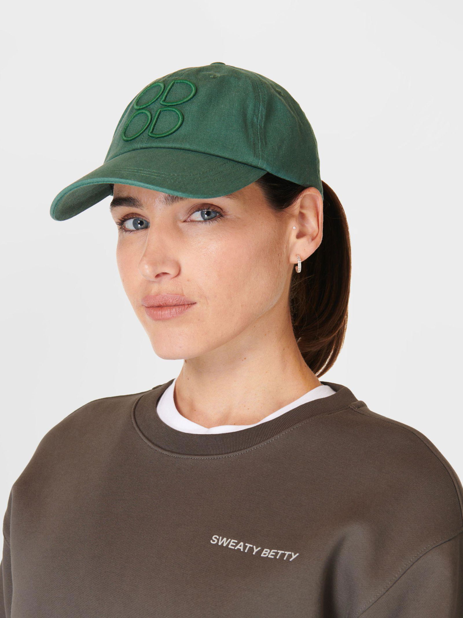 SWEATY BETTY Dot Logo Baseball Cap in Cool Forest Green | endource