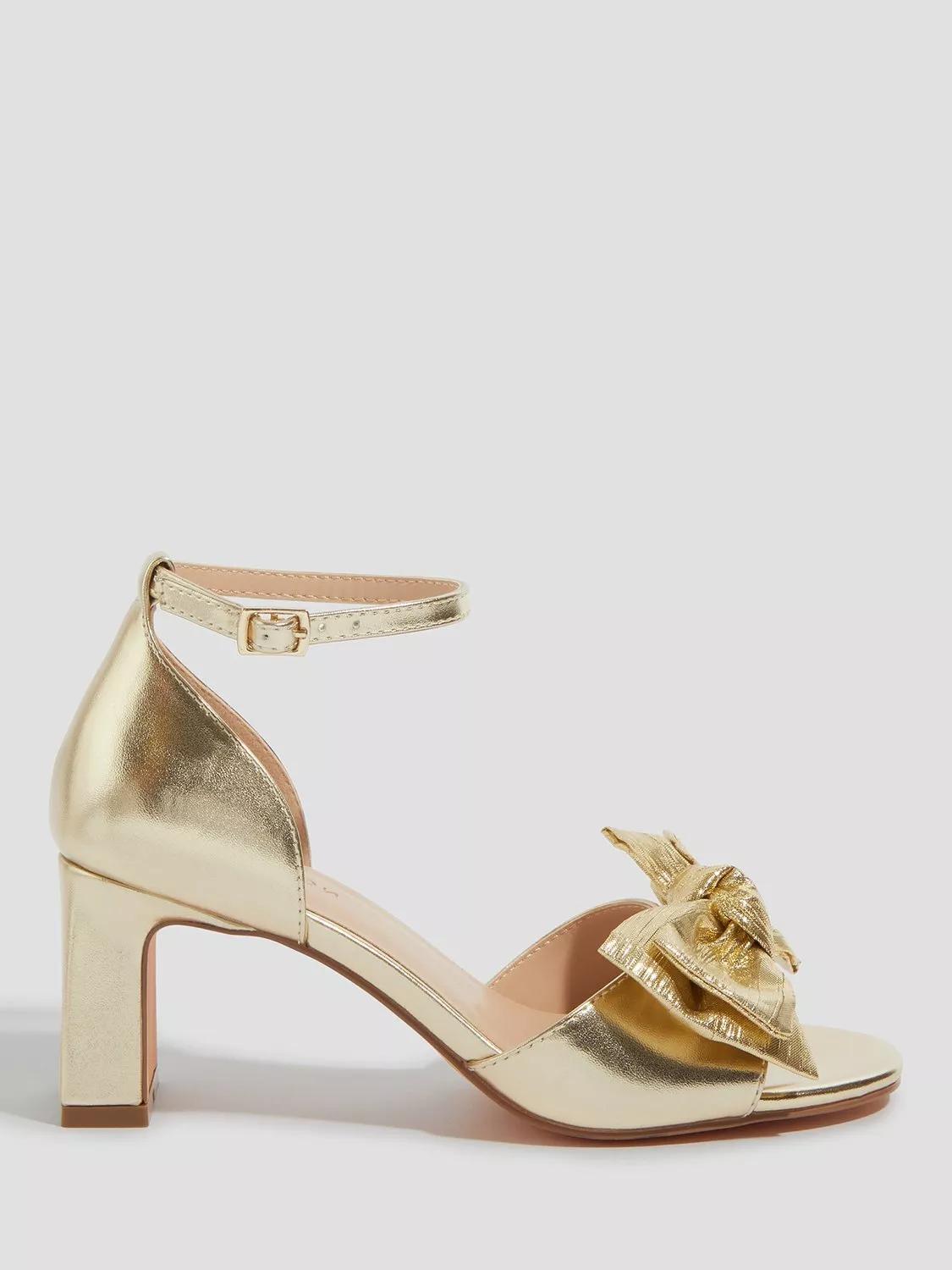 Monsoon Bow Metallic Heeled Sandals in Gold | endource