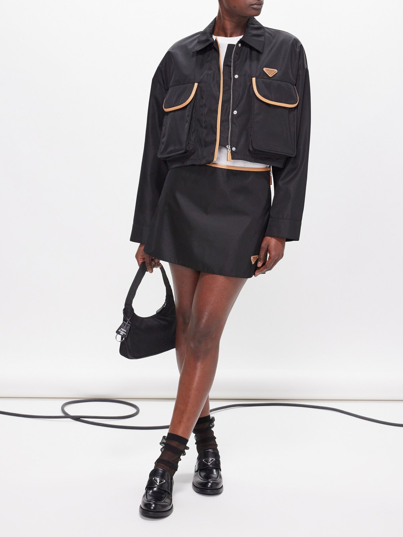 PRADA Cropped Leather-Trimmed Re-Nylon Jacket in Black | Endource